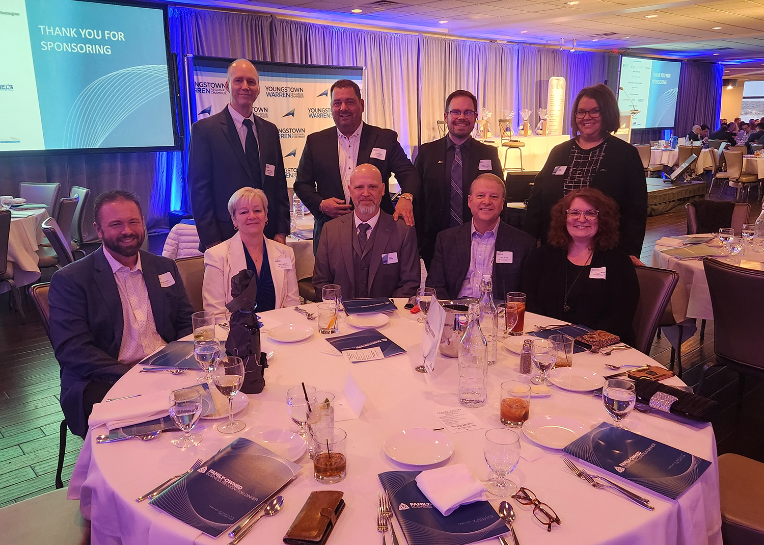 Pictured from Aim front, l-r: Dan Kellgren, Vice President of Software Development; Patty Durkin ...